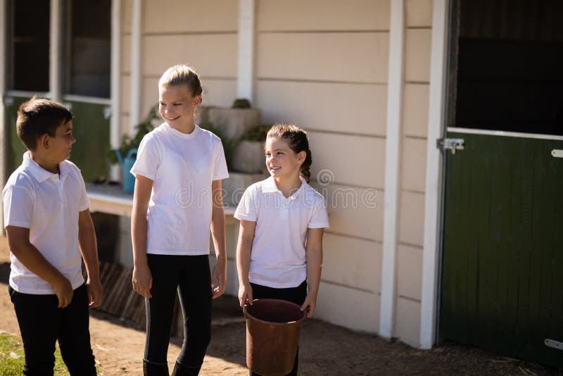 Smiling Kids Talking Outside the Stable Stock Photo - Image of ...