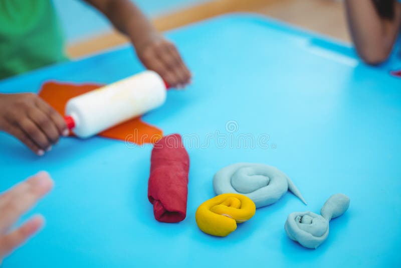 Smiling Kids Using Modelling Clay Stock Image - Image of colours ...