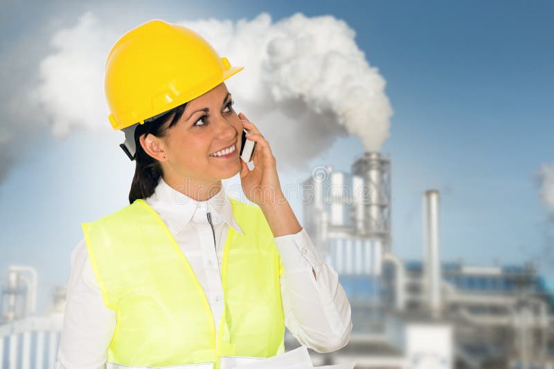 Smiling Lady Engineer Talking on the Phone and the Factory in Th Stock ...