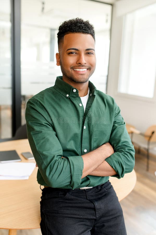 Smiling Latin High Skilled Leader in Casual Wear Looks at the Camera ... Smiling Latin High Skilled Leader in Casual Wear Looks at the Camera ...