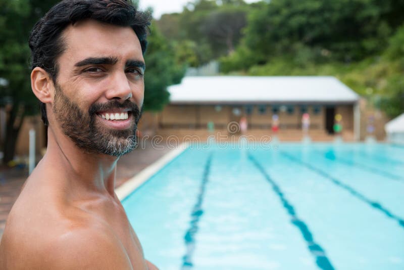 Smiling Lifeguard Standing with Whistle Near Poolside Stock Photo ...
