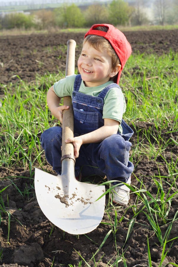 Little Boy To Dig with Big Shovel Stock Photo - Image of helping ...