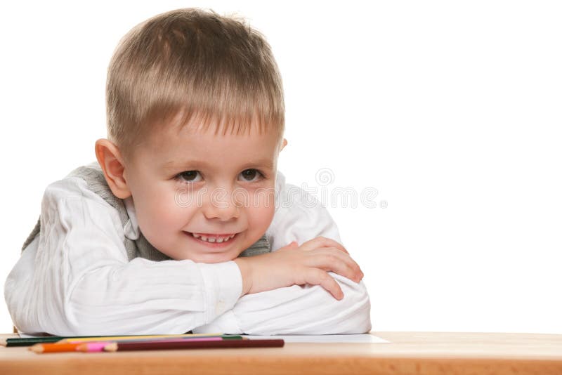 Student smiling at desk stock photo. Image of full, preschool - 2249890