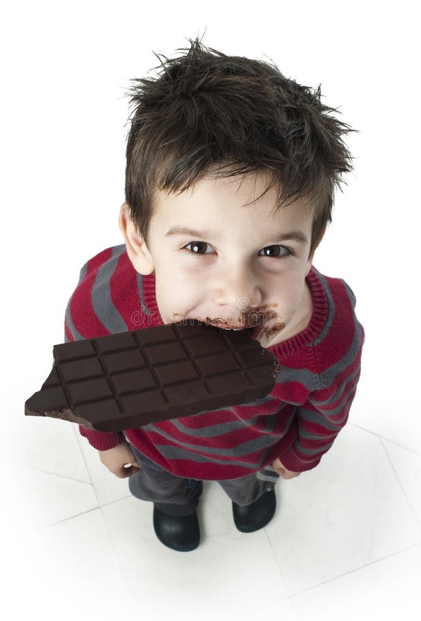 Smiling Little Boy Eating Chocolate Stock Photo - Image of addiction ...