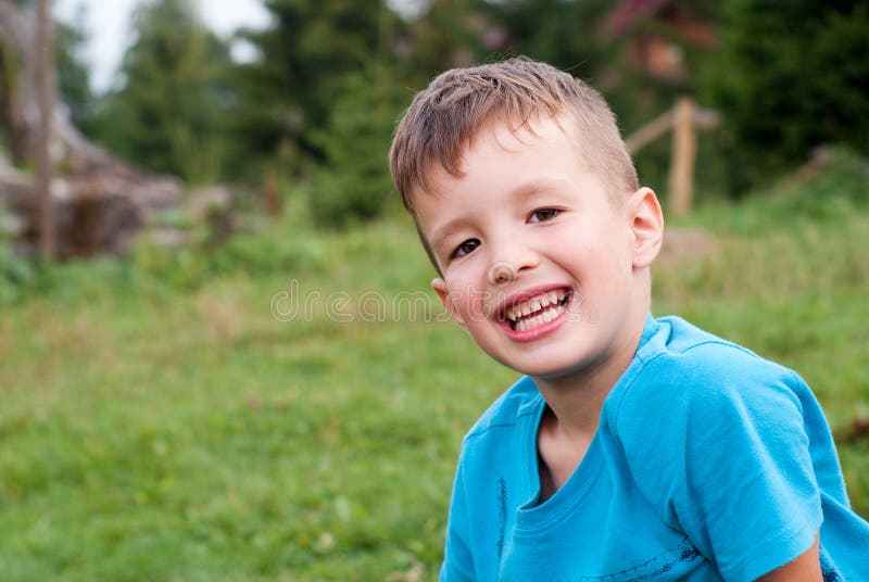 Smiling little boy outdoor stock image. Image of forest - 68174441