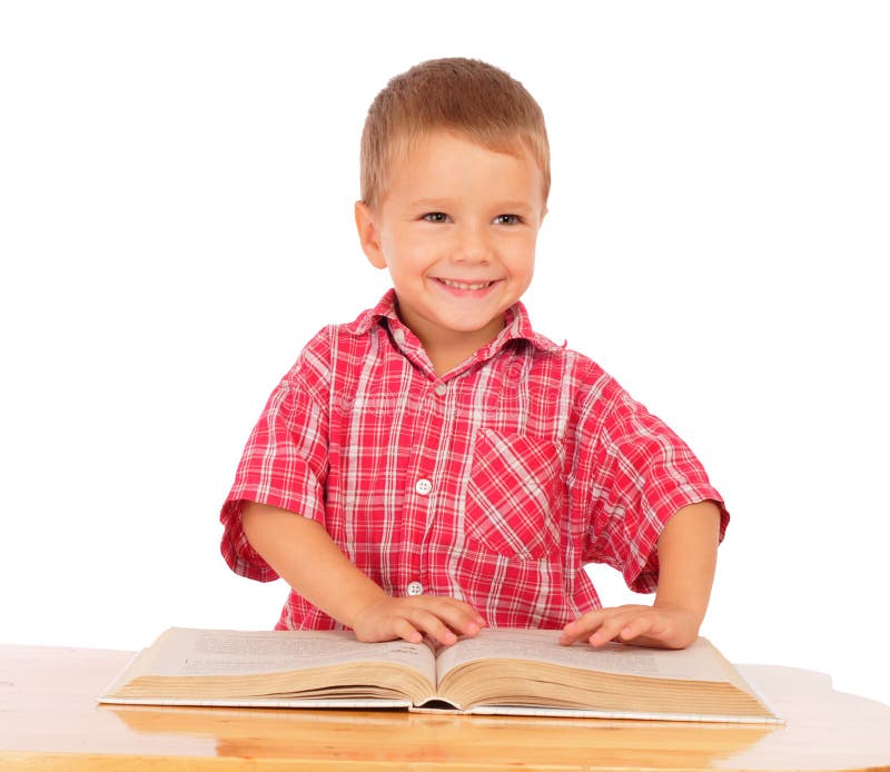 Smiling Little Boy Reading Book on the Desk Stock Photo - Image of ...