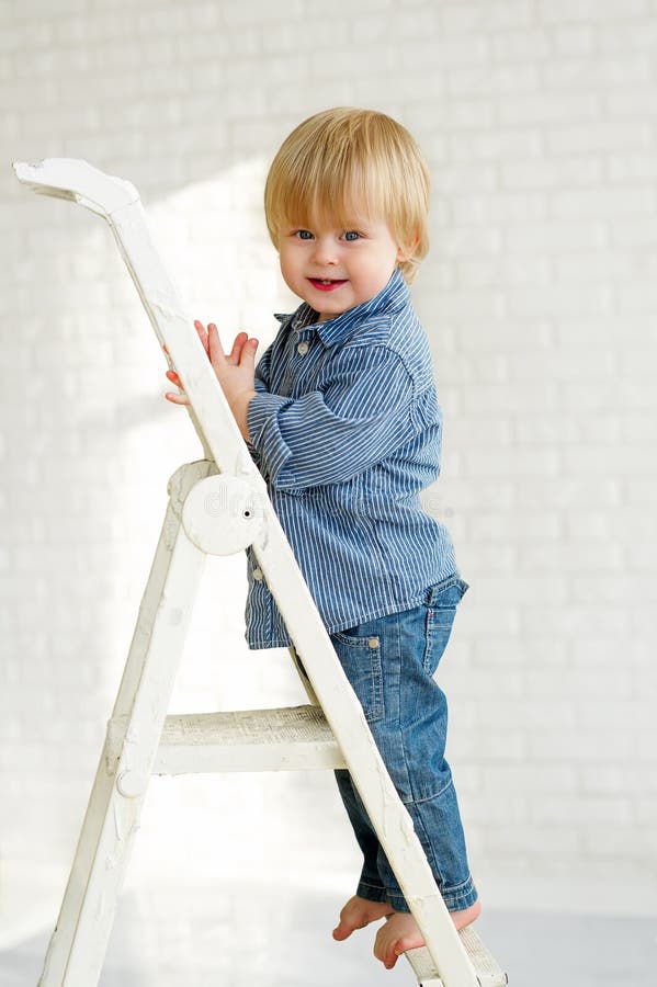 Smiling Little Boy Standing on the Step of a Ladder Stock Image - Image ...