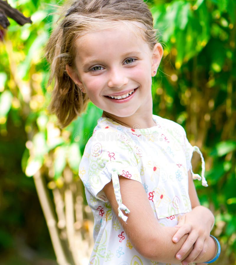 Smiling little girl stock photo. Image of little, enjoyment - 26111204 Smiling little girl stock photo. Image of little, enjoyment - 26111204