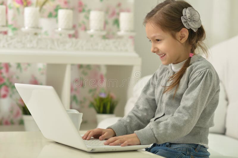 Smiling Little Girl with Laptop Computer Stock Photo - Image of ...