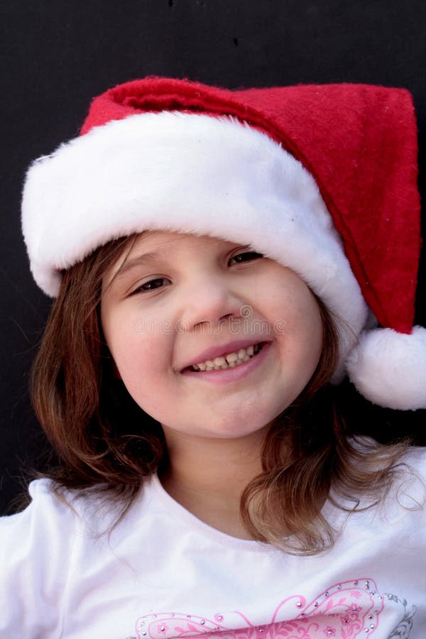 Smiling Little Girl in Santa Hat Stock Image - Image of santa, noel ...