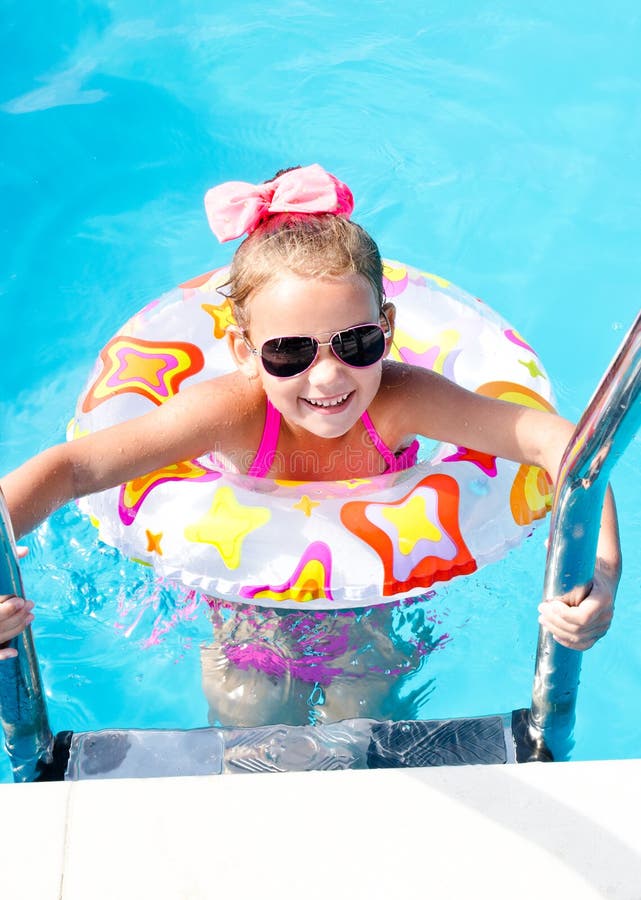 Smiling Little Girl in Swimming Pool Stock Image - Image of portrait ...