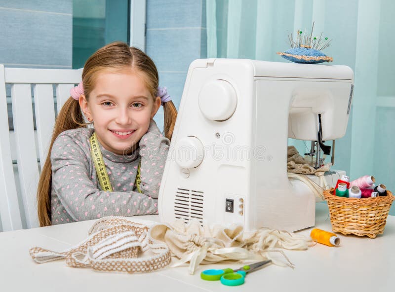 Smiling Little Girl at the Table with Sewing Stock Image - Image of ...
