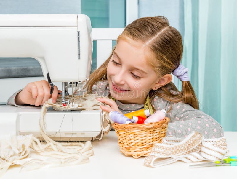 Smiling Little Girl at the Table with Sewing Stock Image - Image of ...