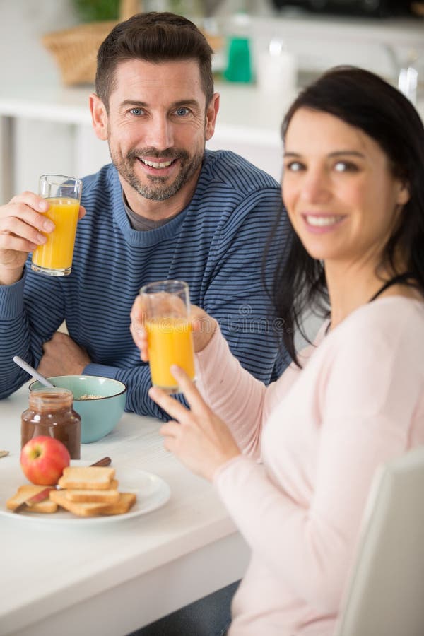 Smiling Love Couple Talking during Breakfast Stock Photo - Image of ...
