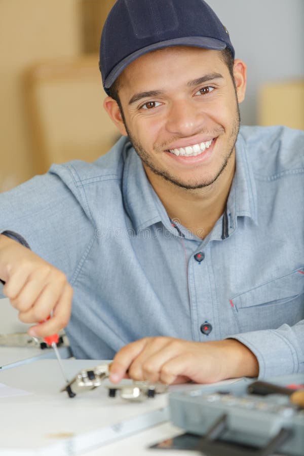 Smiling Machinist with Spanner Stock Image - Image of troubleshooting ...