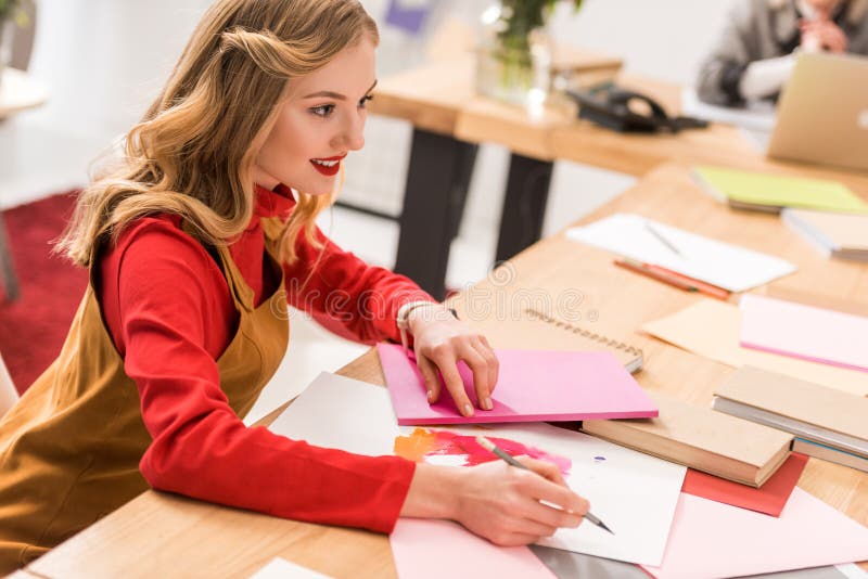 Magazine Editor Talking on Phone and Looking at Color Palette Stock ...