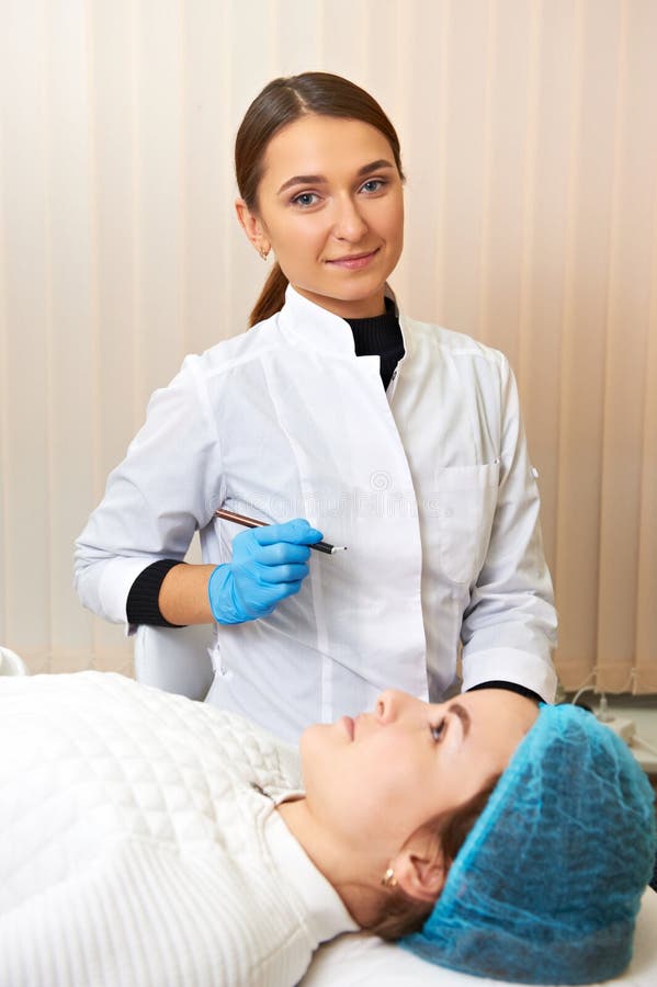 Smiling Make-up Wizard Makes Eyebrow Correction Procedure. Stock Image ...