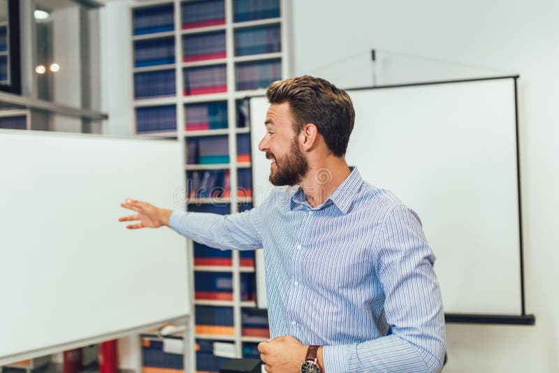 Male Coach Giving Presentation for Audience in Lecture Hall Stock Photo ... Male Coach Giving Presentation for Audience in Lecture Hall Stock Photo ...