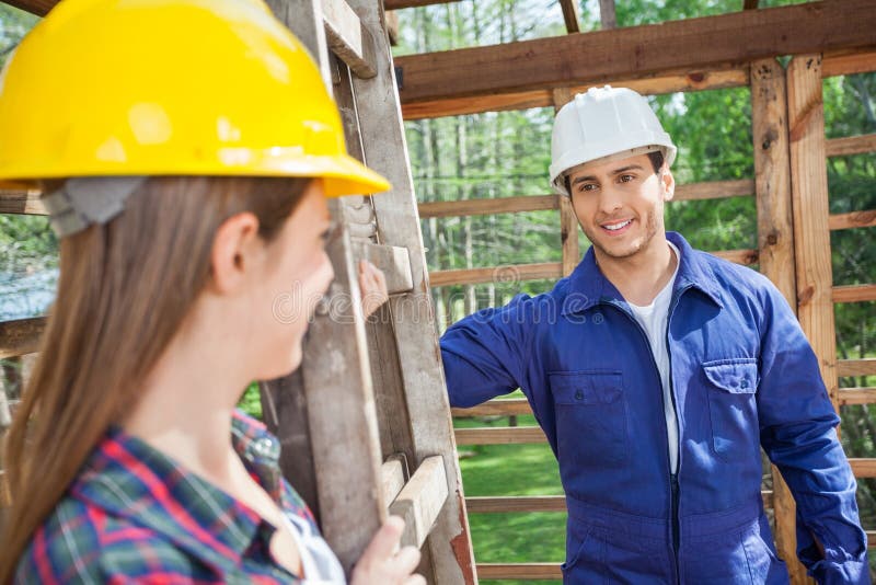 Smiling Male Construction Worker Looking at Female Stock Image - Image ...