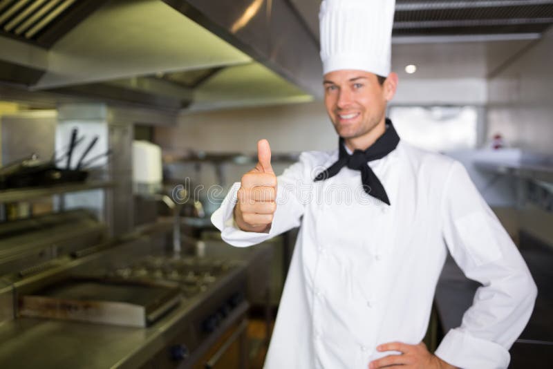 Smiling Male Cook Gesturing Thumbs Up in Kitchen Stock Photo - Image of ...