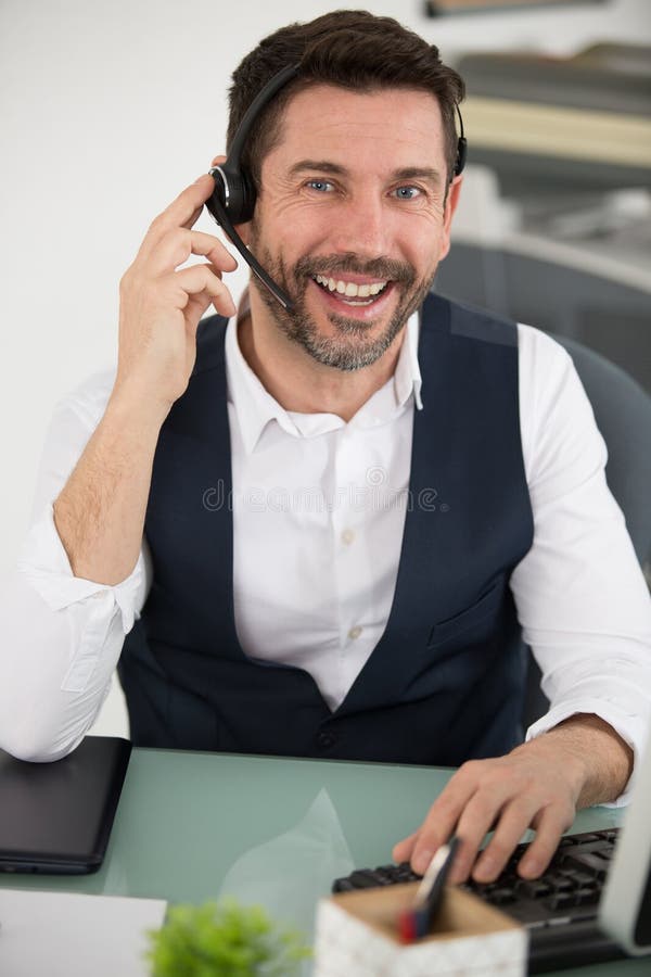 Smiling Male Customer Support Agent Stock Photo - Image of beard ...