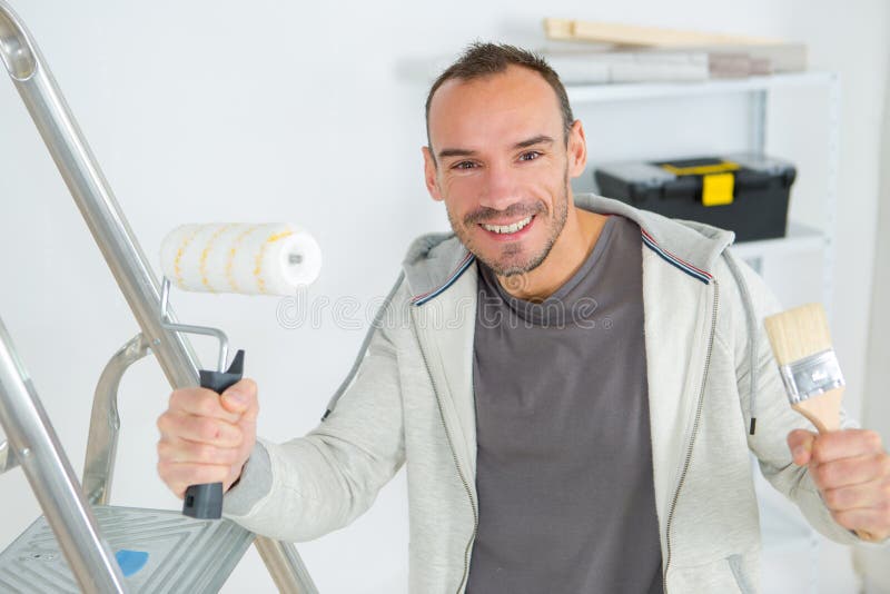 Smiling Male Painter at Work Stock Image - Image of interior, male ...