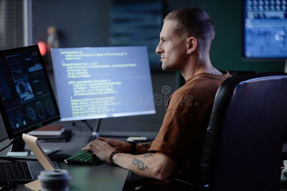 Smiling Male it Programmer Using Computer Working at Desk Indoors Stock ...