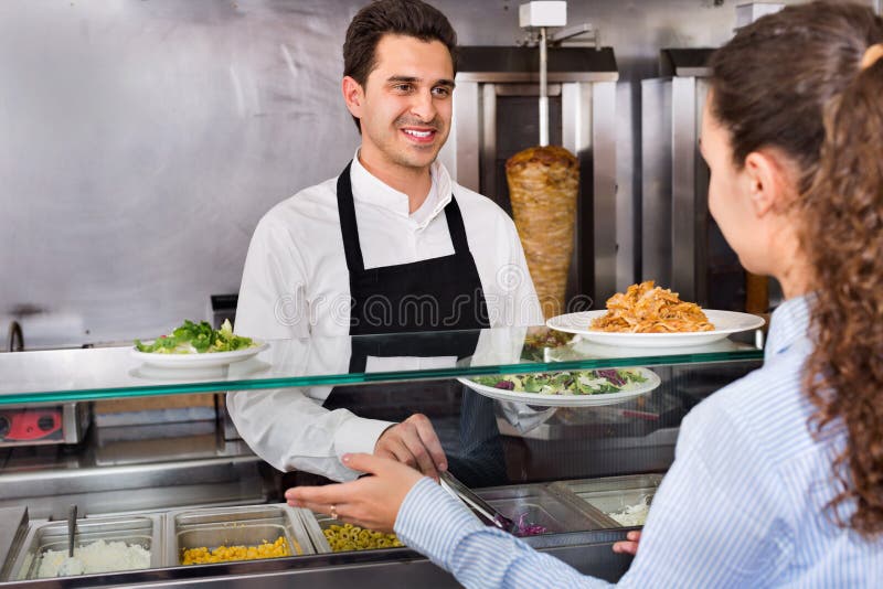 Smiling Male Worker Serving Customer with Smile at Shawarma Place Stock ...