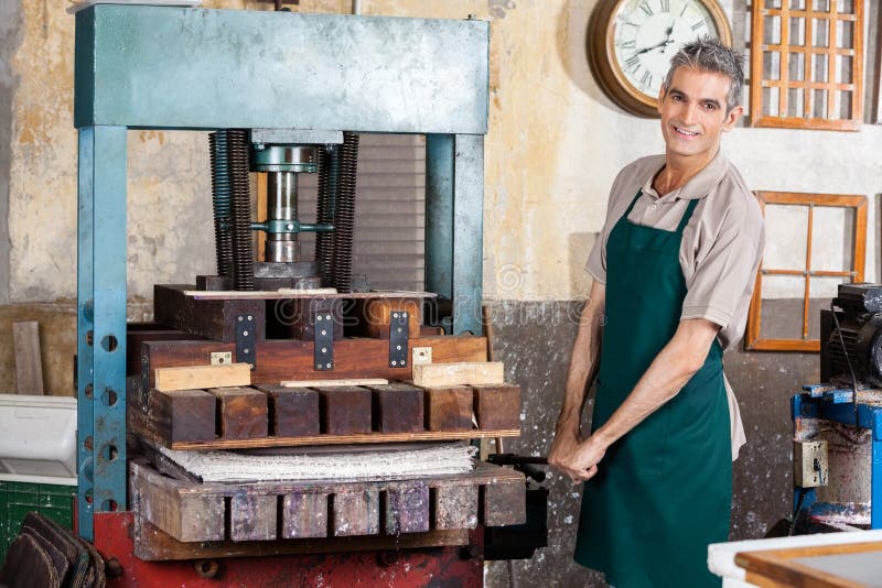 Smiling Male Worker Using Paper Press Machine Stock Image - Image of ...