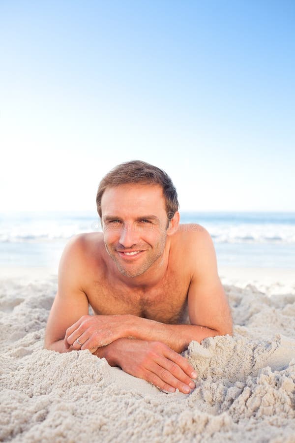 Smiling man at the beach stock photo. Image of pursuit - 18493118