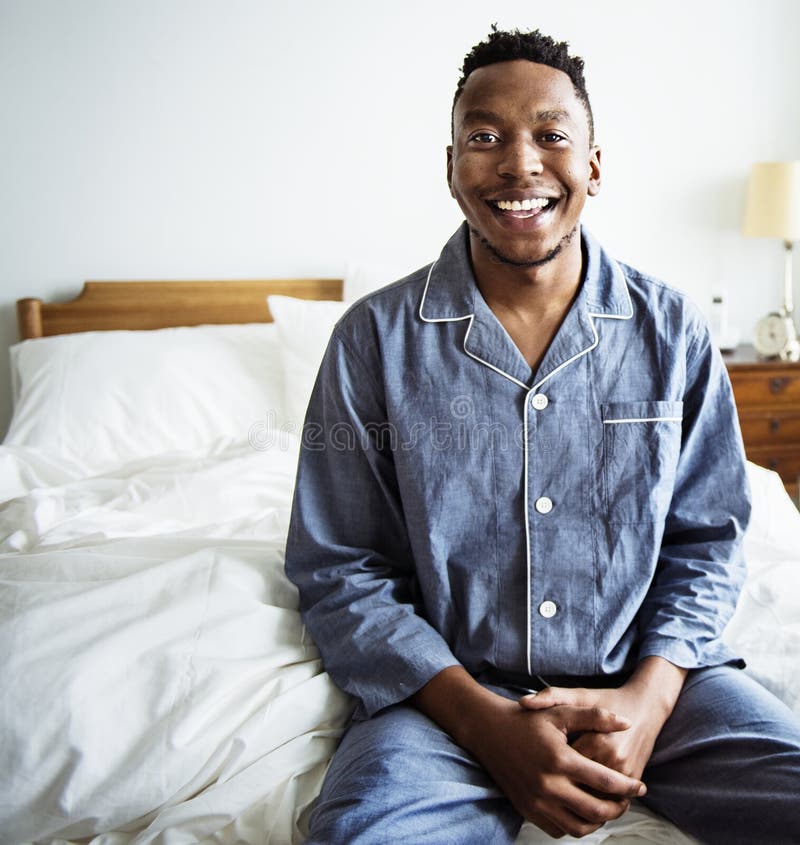 A smiling man in bed stock image. Image of person, enjoy - 108688011