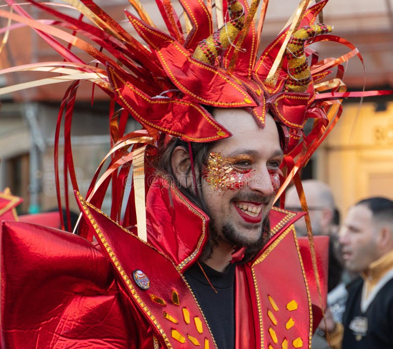 Smiling Man in a Bright Red Suit at a Carnival Editorial Photography ...