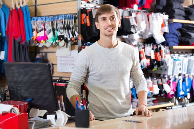 Smiling Man Cashier at the Pay Desk Stock Photo - Image of cheerful ...