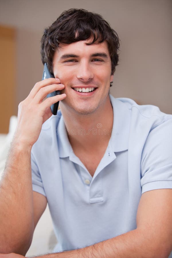Smiling Man on the Cellphone Stock Image - Image of relaxing, sitting ...