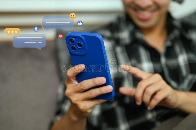 Smiling Man Chatting or Text Messages on His Smartphone. Technology and ...