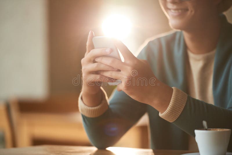 Smiling man checking phone stock photo. Image of enjoying - 114273204