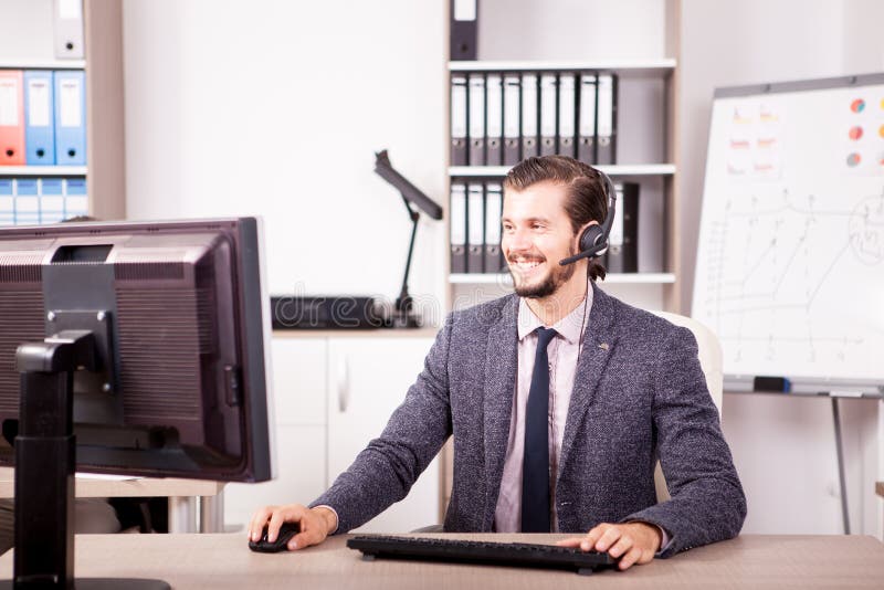 Smiling Man from Customer Service Support Working in the Office Stock ...