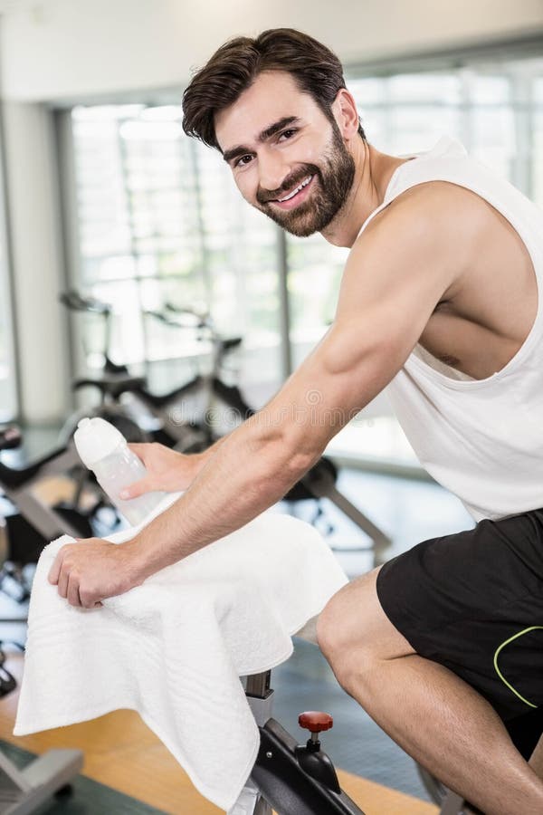 Smiling Man on Exercise Bike Looking at the Camera Stock Image - Image ...