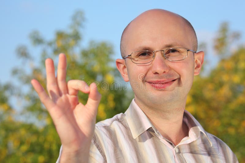Smiling Man in Fall Park with Thumbs Up Gestures Stock Image - Image of ...