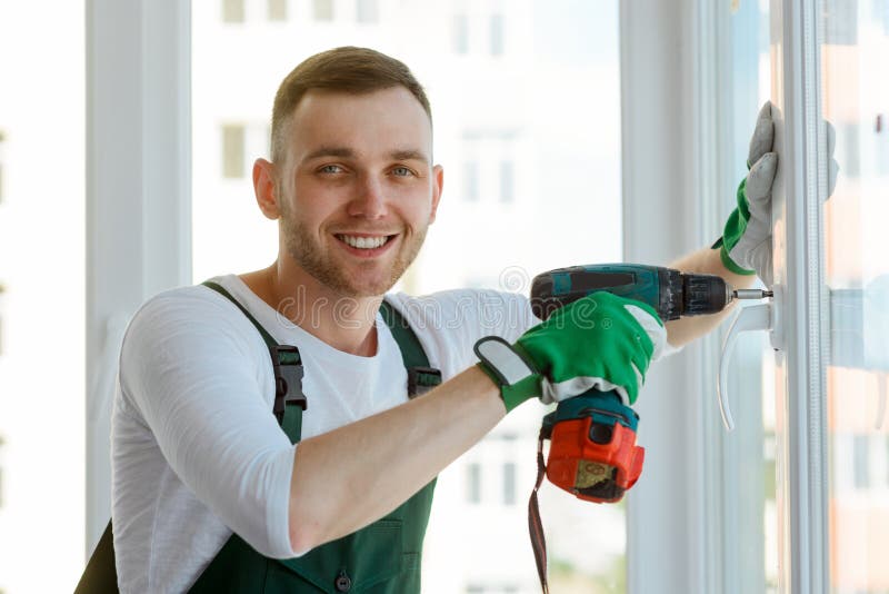 Smiling Man Fixing a Handle Stock Photo - Image of home, installing ...