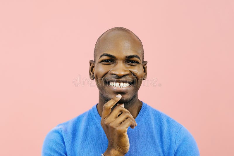 Smiling Man with Hand on Chin Looking at Camera Stock Photo - Image of ...