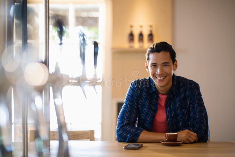 Smiling Man Having Coffee in Restaurant Stock Photo - Image of hotel ...