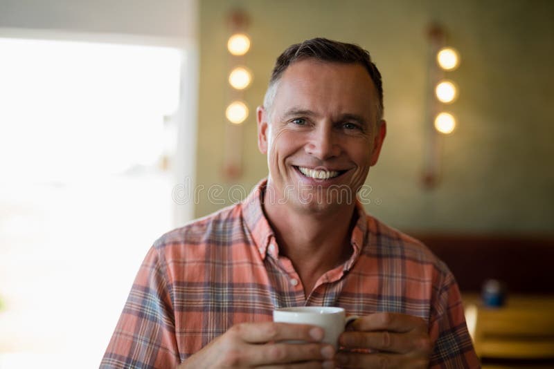 Smiling Man Having Cup of Coffee in Restaurant Stock Image - Image of ...