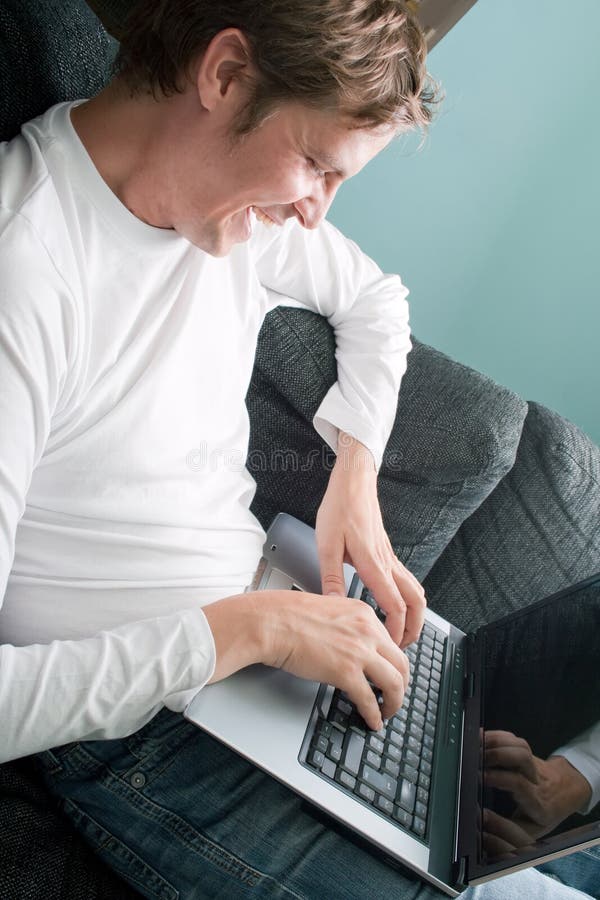 Smiling Man Having Fun on Laptop Computer Stock Photo - Image of person ...
