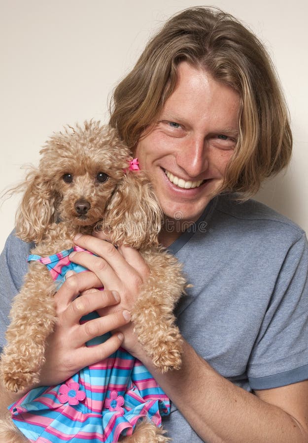 Smiling Man and His Dog stock photo. Image of embracing - 25304360