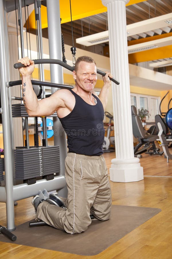 Smiling Man in His Forties Exercising in Gym Stock Image - Image of ...