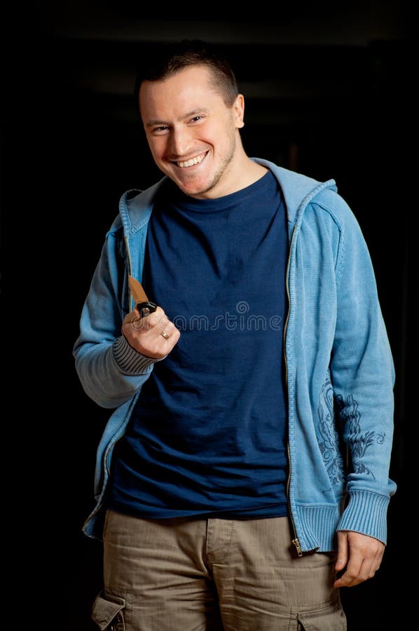 Smiling man holding knife stock image. Image of bandit - 19437183