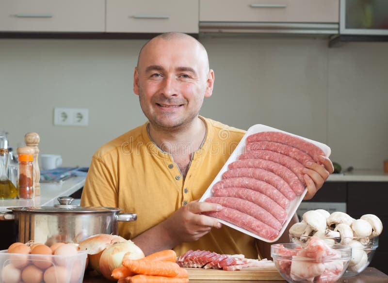 Smiling Man in Kitchen Preparing Meat Stock Photo - Image of occupation ...