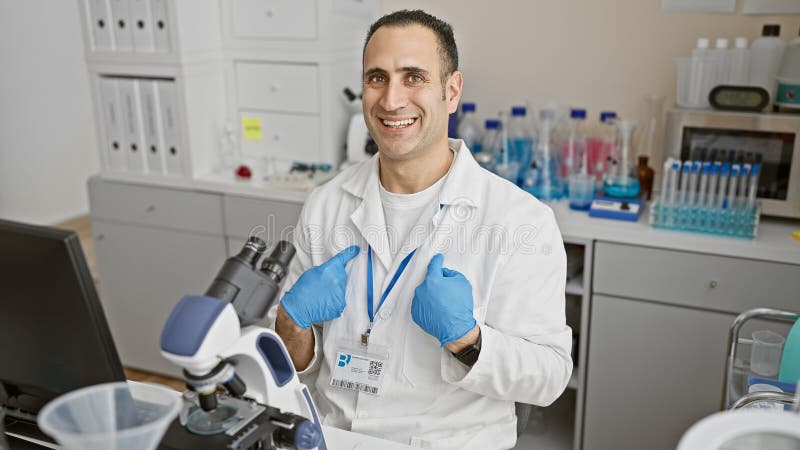 Man in a Lab Coat Using a Microscope To Examine a Sample, Suitable for ...