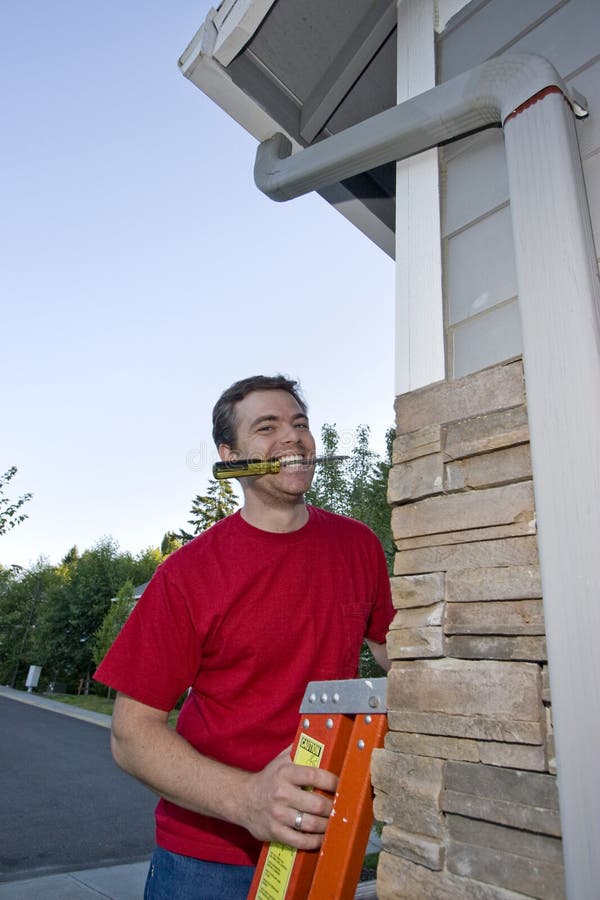 Smiling Man on Ladder - Vertical Stock Photo - Image of climbing ...